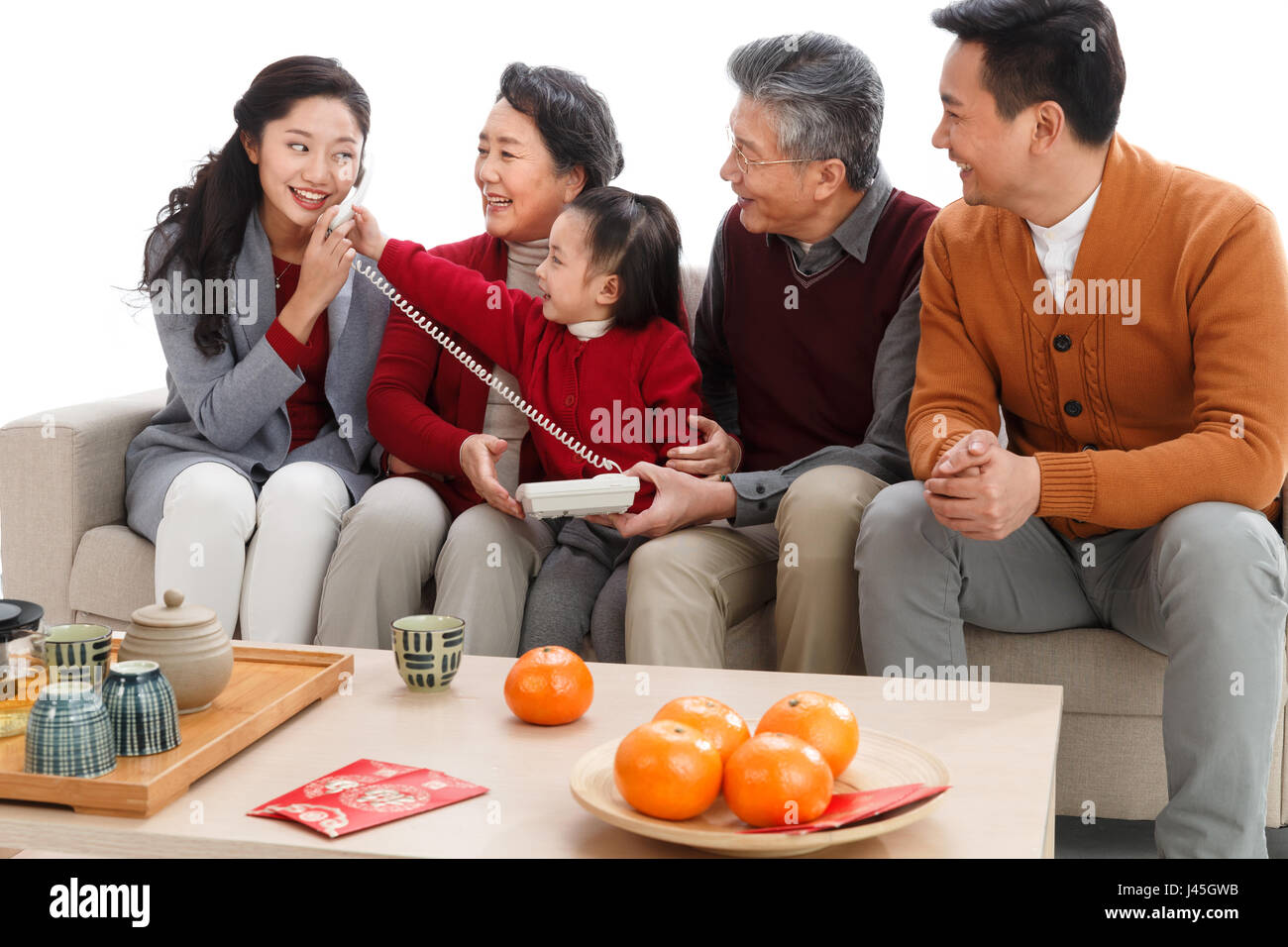 Happy family phone pay New Year's call Stock Photo - Alamy
