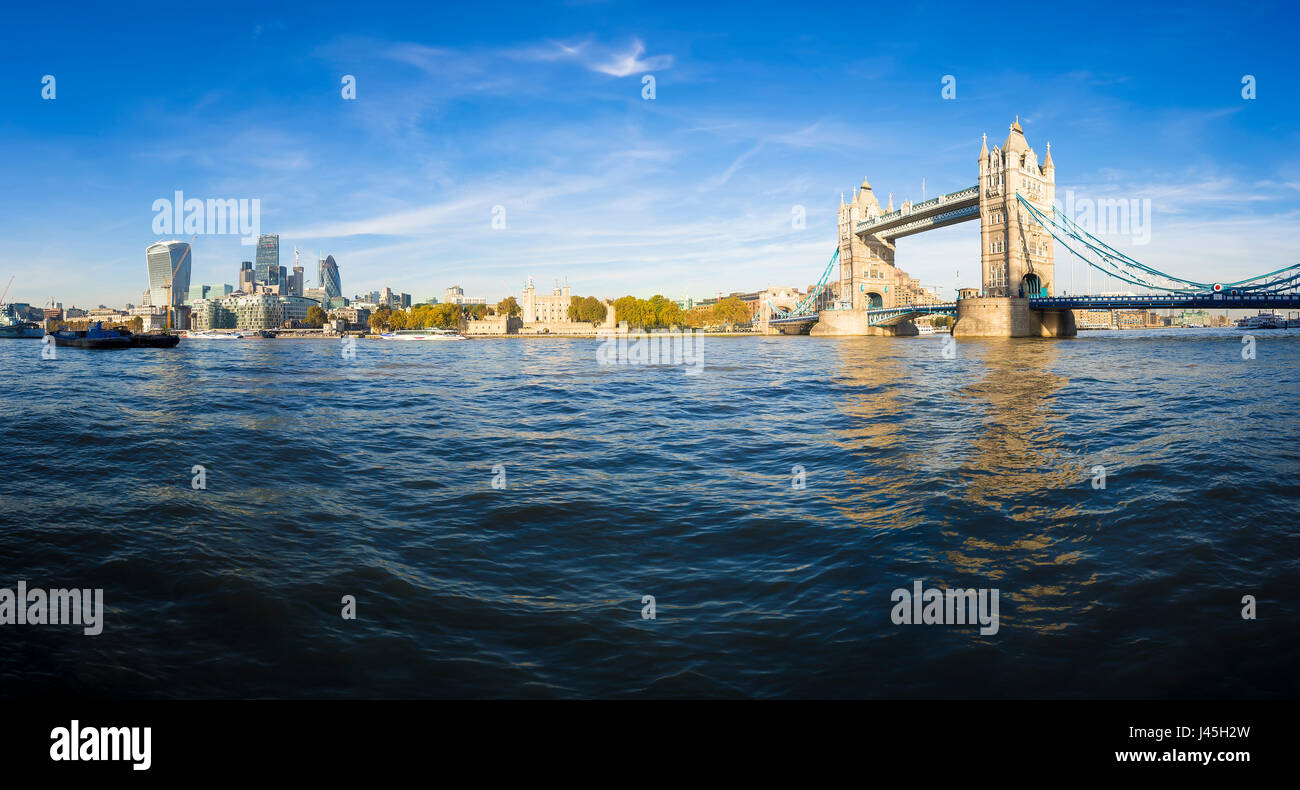 Bright blue sky view of the old stone Tower Bridge drawbridge with the ...