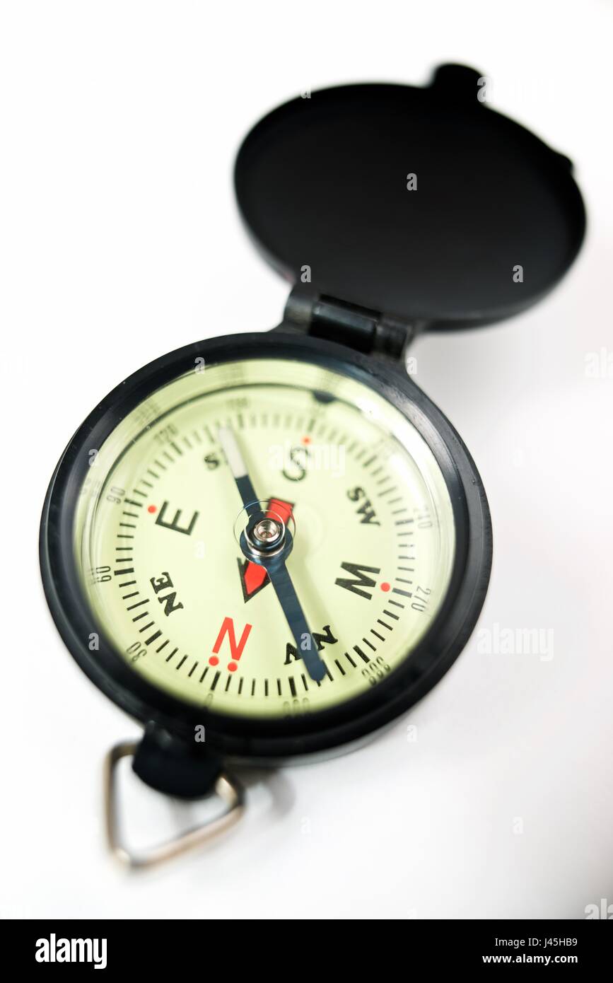 Closeup of a compass on white background Stock Photo - Alamy