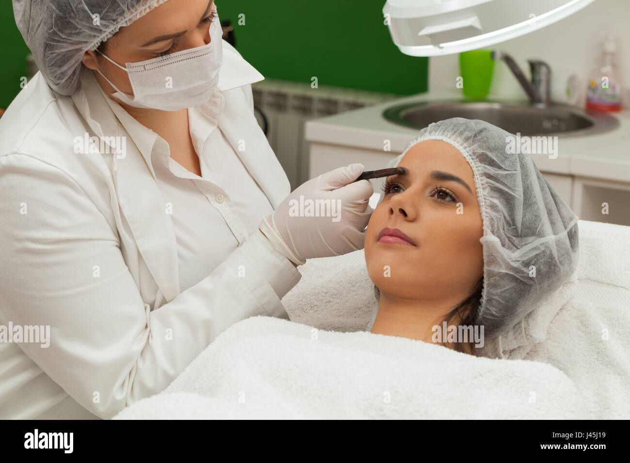 Permanent make up eyebrows in beauty salon Stock Photo - Alamy