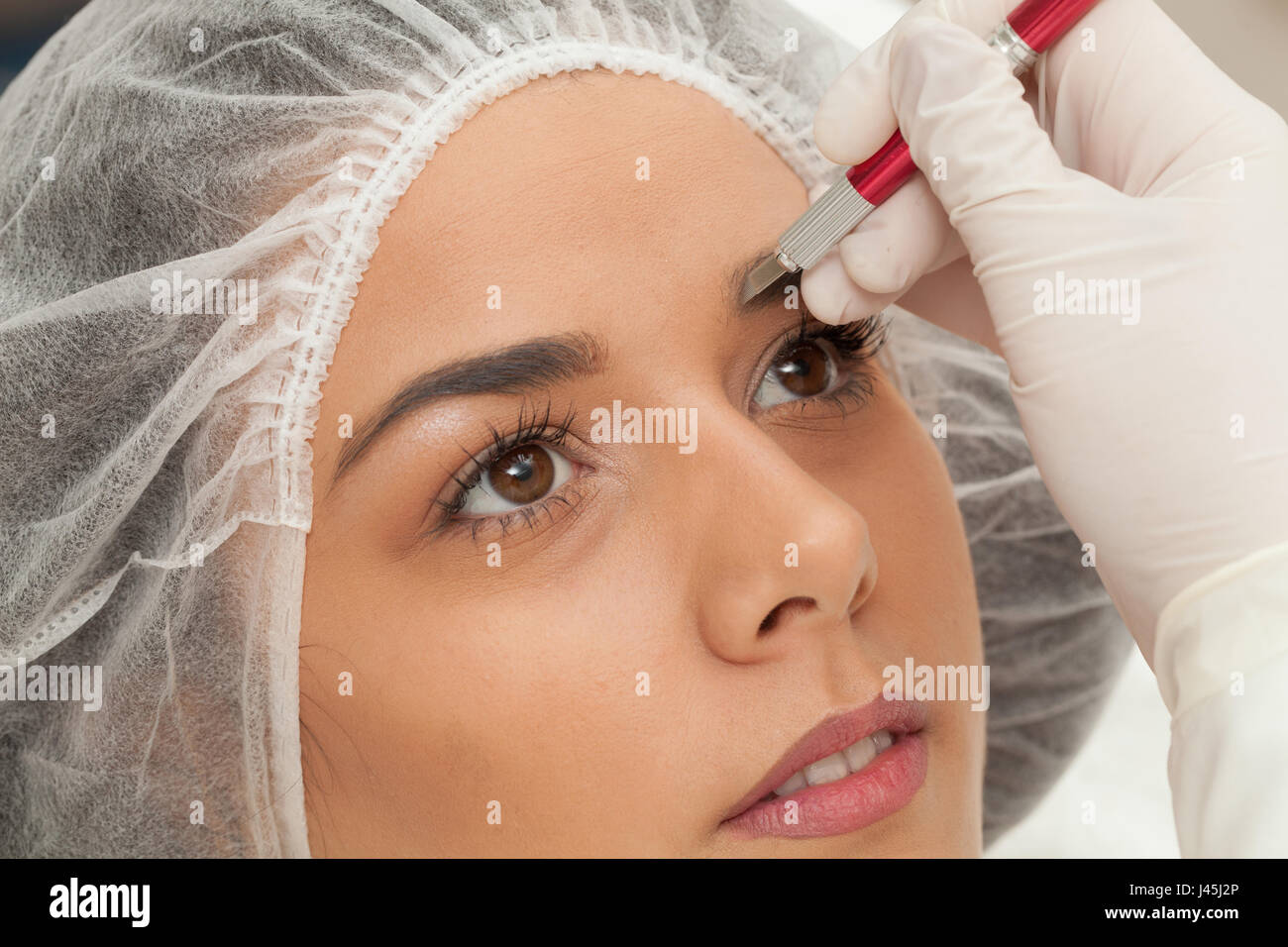 Permanent make up eyebrows in beauty salon Stock Photo - Alamy
