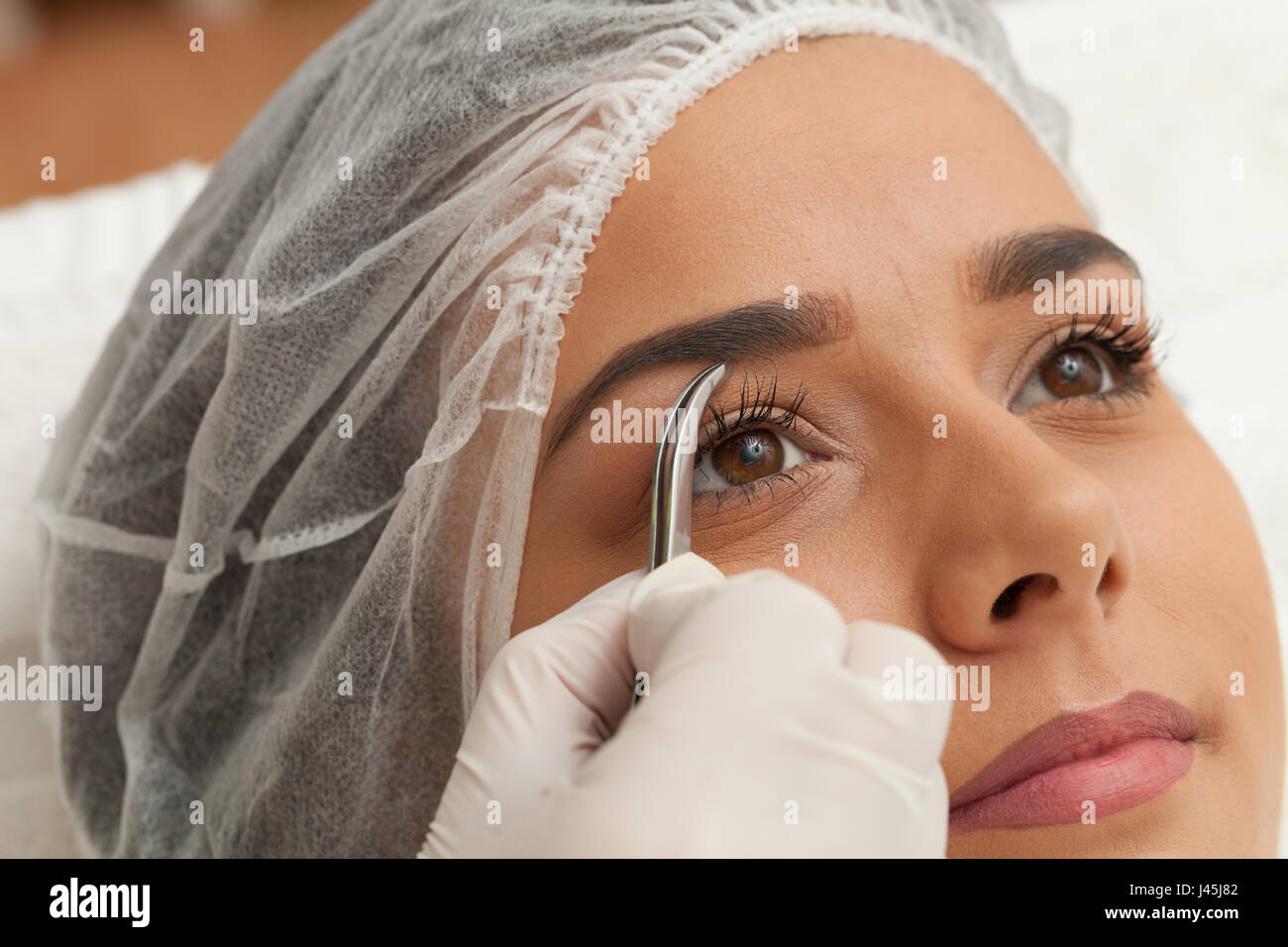 Permanent make up eyebrows in beauty salon Stock Photo - Alamy