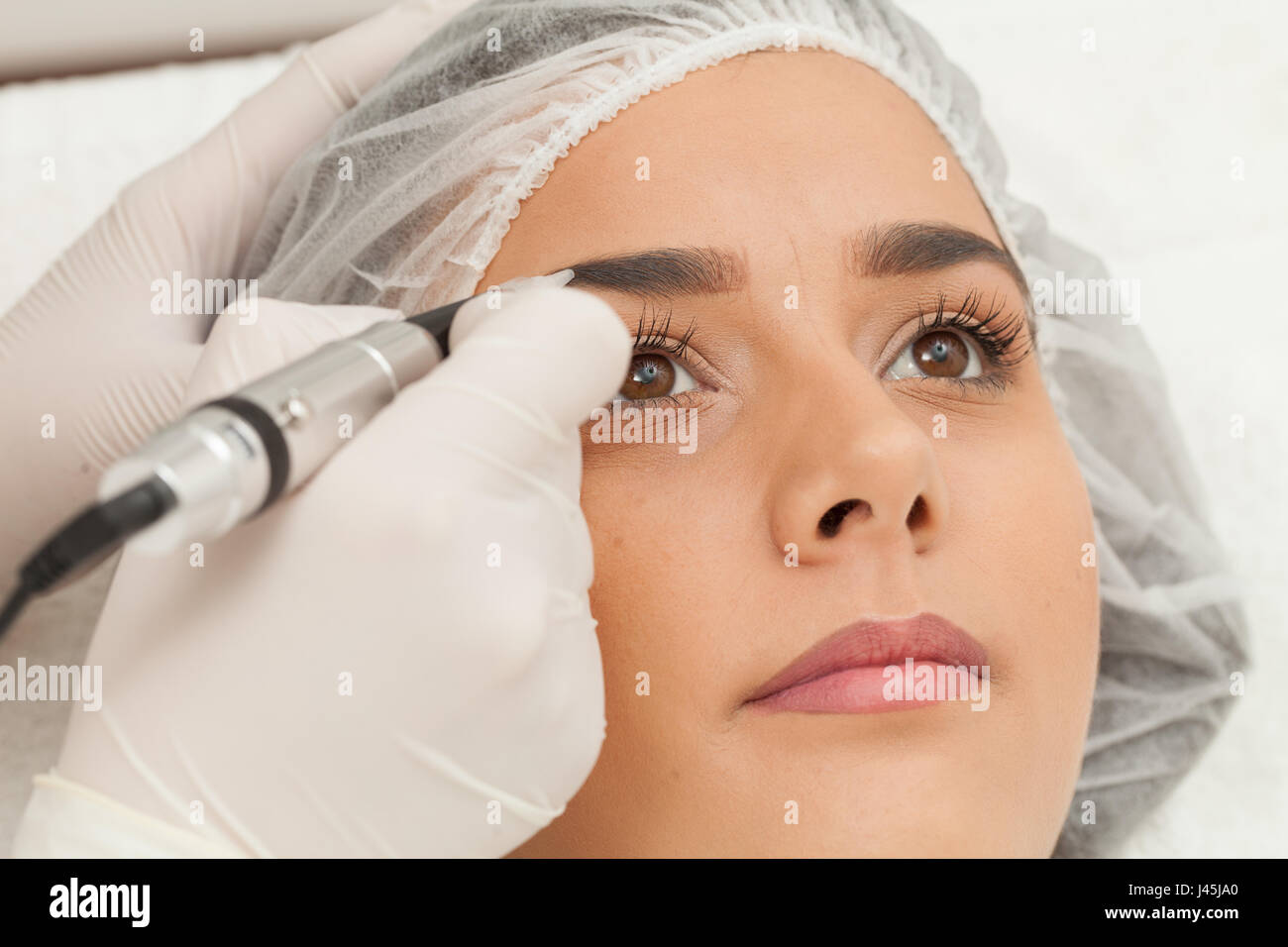 Permanent make up eyebrows in beauty salon Stock Photo - Alamy