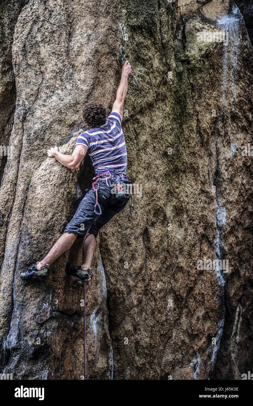 Young male climber leading a route on a rock. Sokoliki, Poland Stock ...