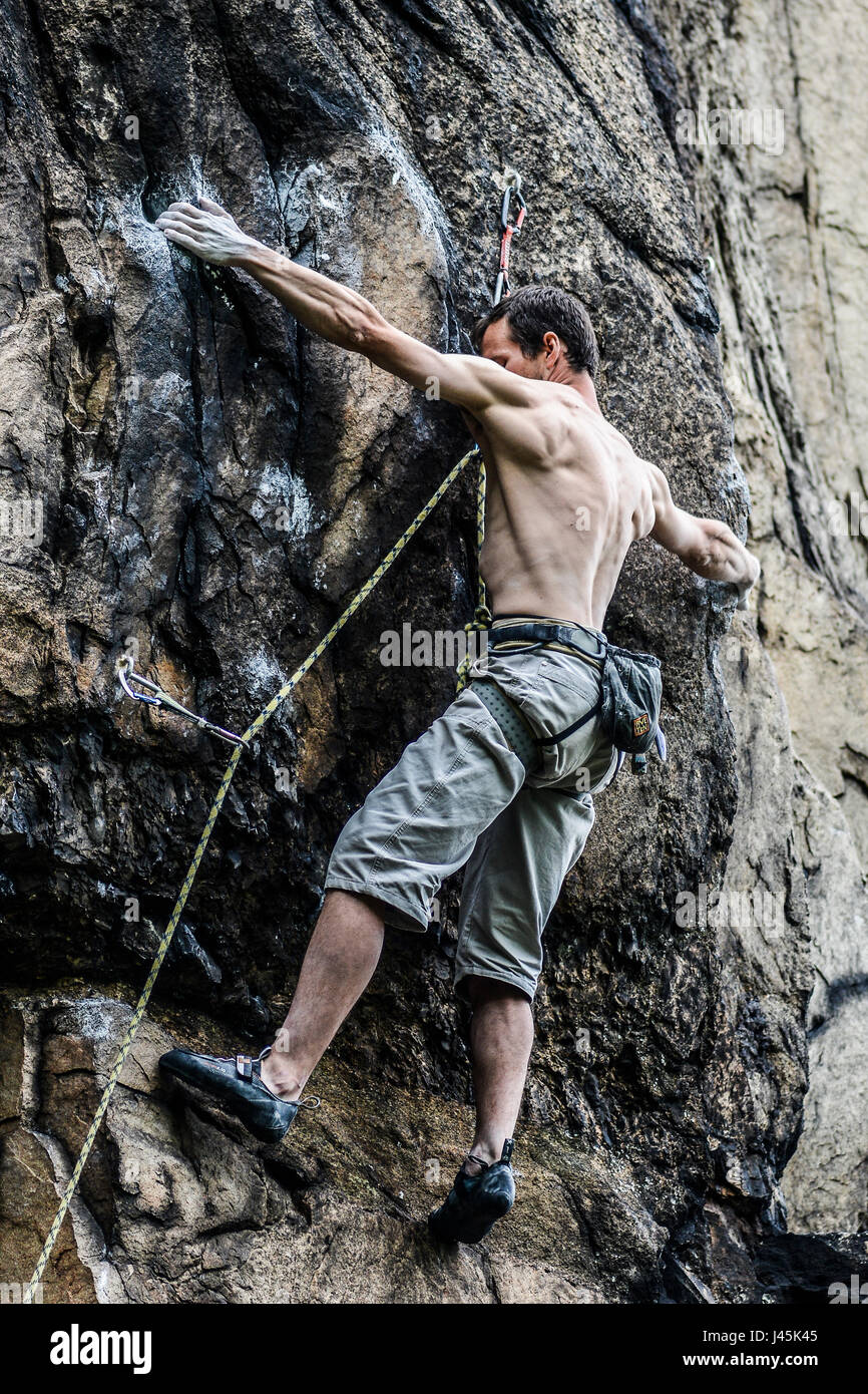 Young male climber leading a route on a rock. Sokoliki, Poland Stock ...