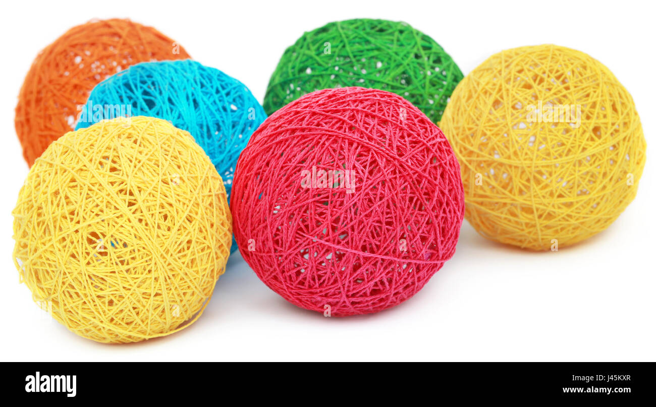 Decorative hollow thread rolls over white background Stock Photo - Alamy