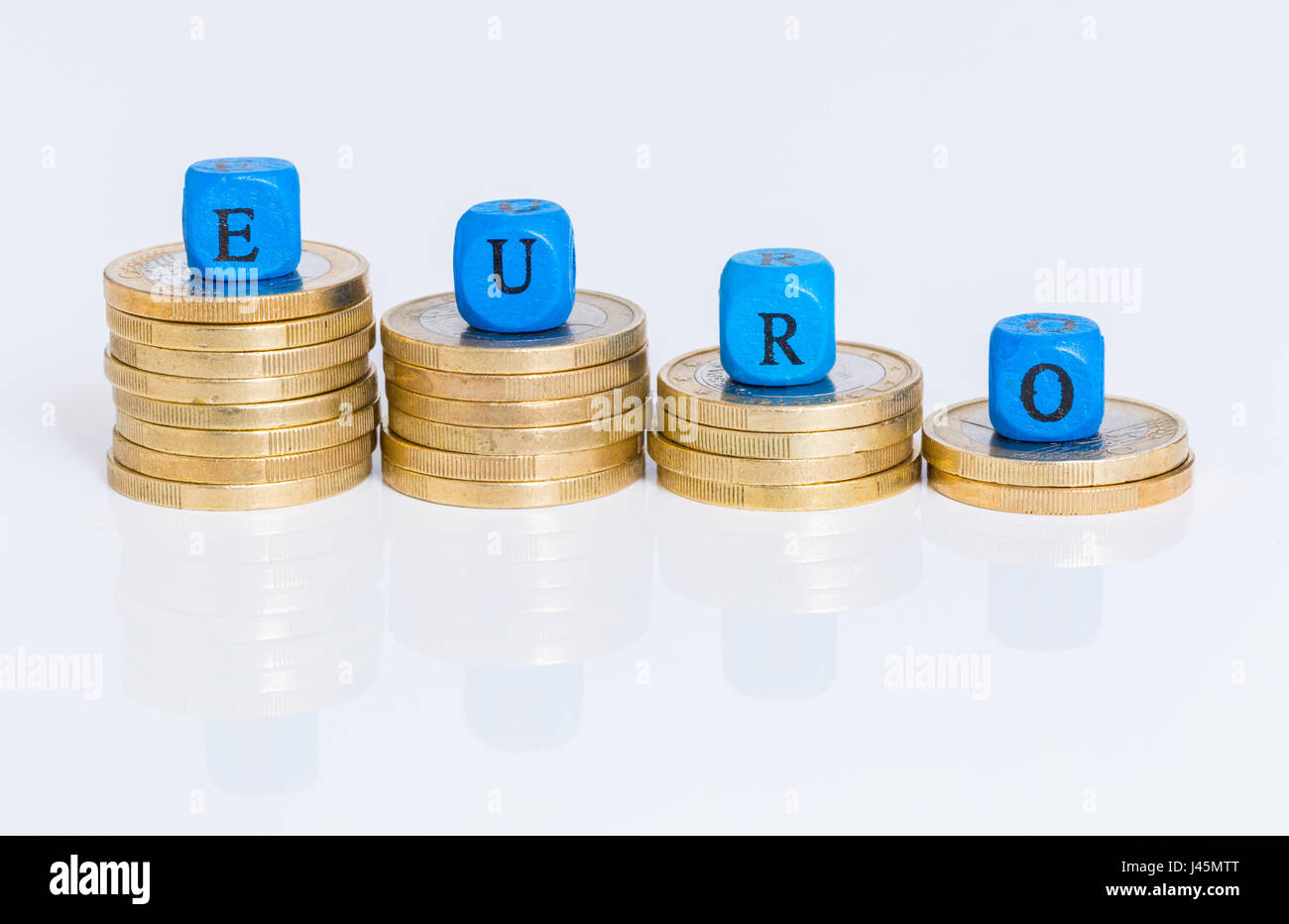 Euro letter cubes with coins against white background Stock Photo - Alamy