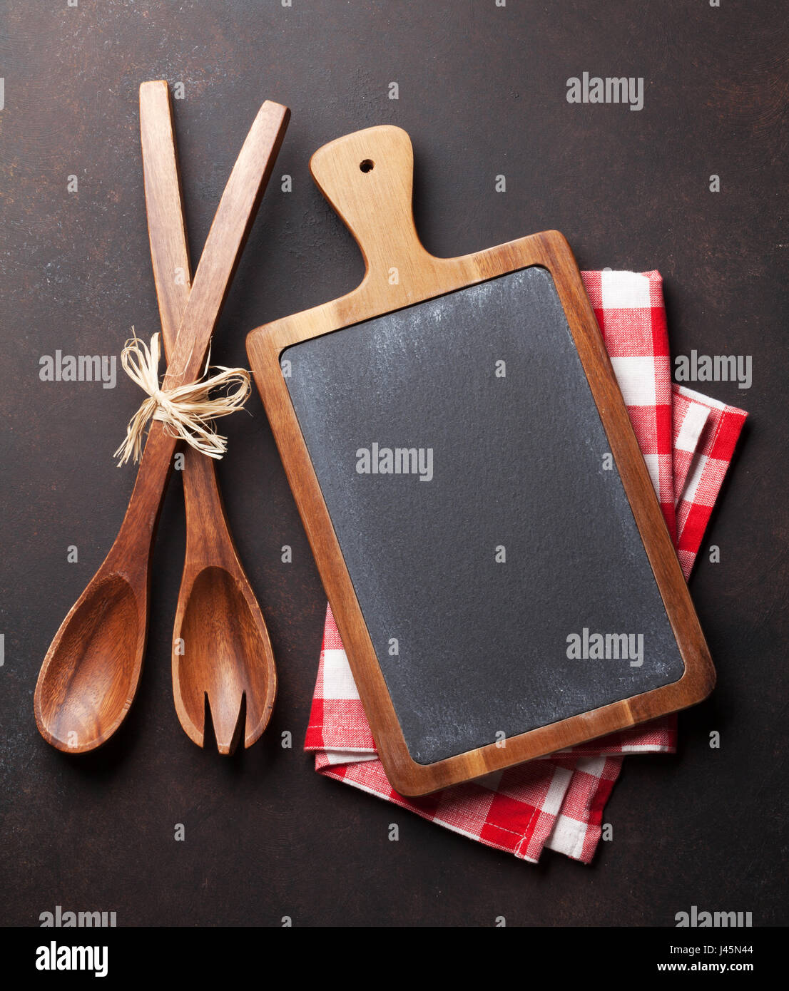 Cooking utensils on stone table. Top view with chalkboard for your ...