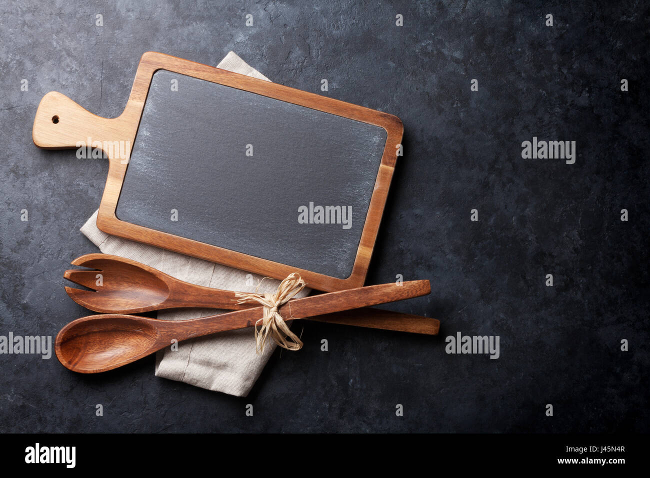 Cooking utensils on stone table. Top view with chalkboard for your ...