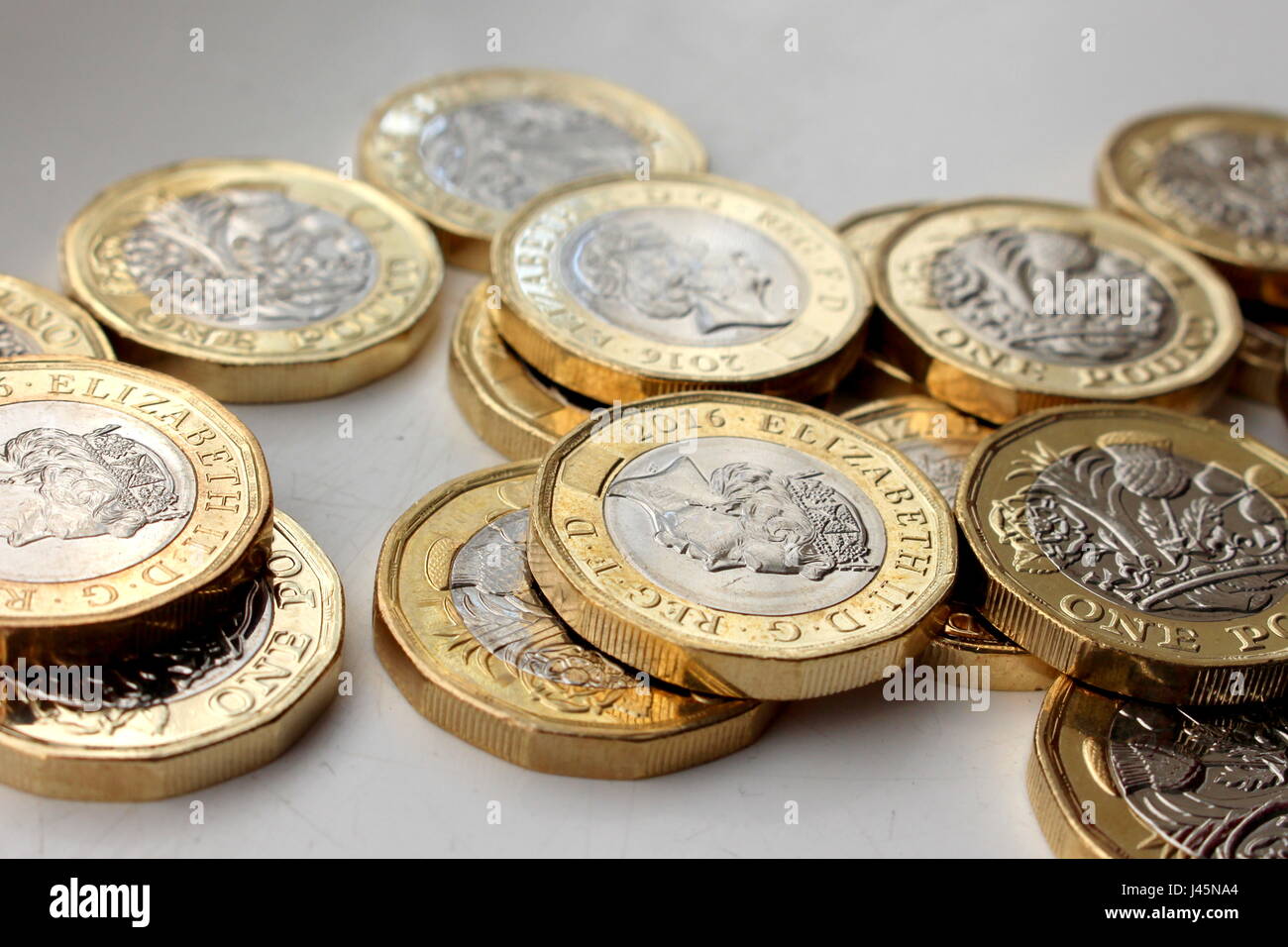 A pile of new British sterling 12-sided pound coins Stock Photo - Alamy