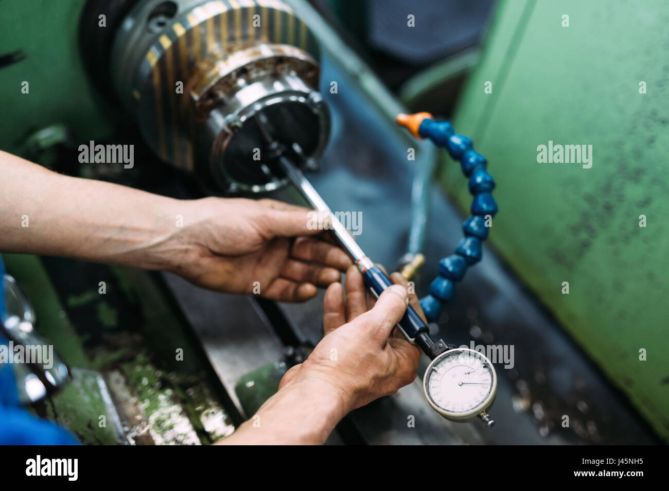 Tired overworked worker falls asleep during working hours in factory ...
