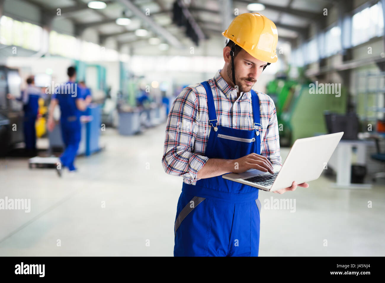 industrial factory worker working in metal manufacturing industry Stock ...