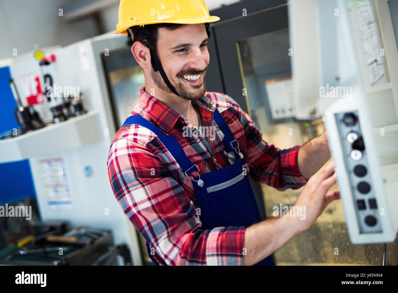 Mechanic working on lathe machine hi-res stock photography and images ...