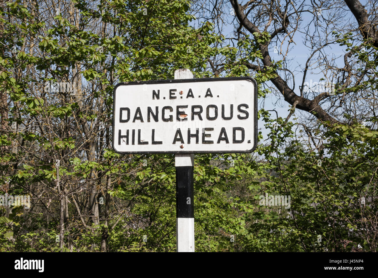 A road sign waning of" Dangerous Hill Ahead" at Beamish Museum,England ...