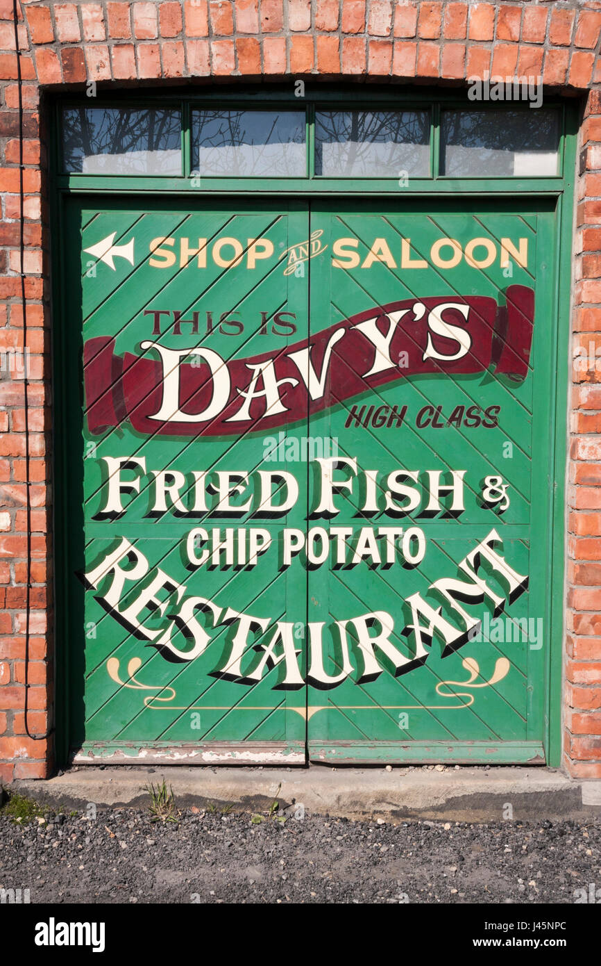 A sign on green doors advertising Davys Fish and Chip Restaurant at ...