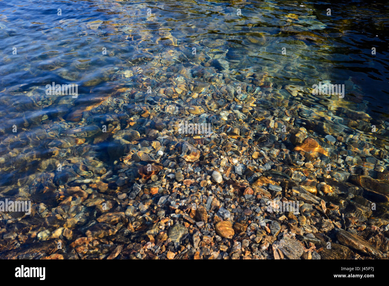 River bed of Afon Nant Peris in the Llanberis Pass showing the mosaic ...
