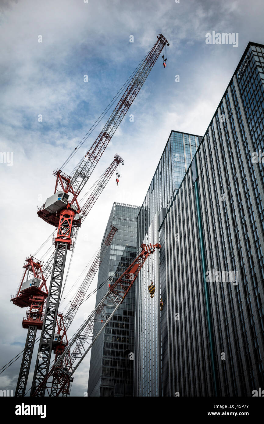 Cranes and skyscrapers Stock Photo - Alamy
