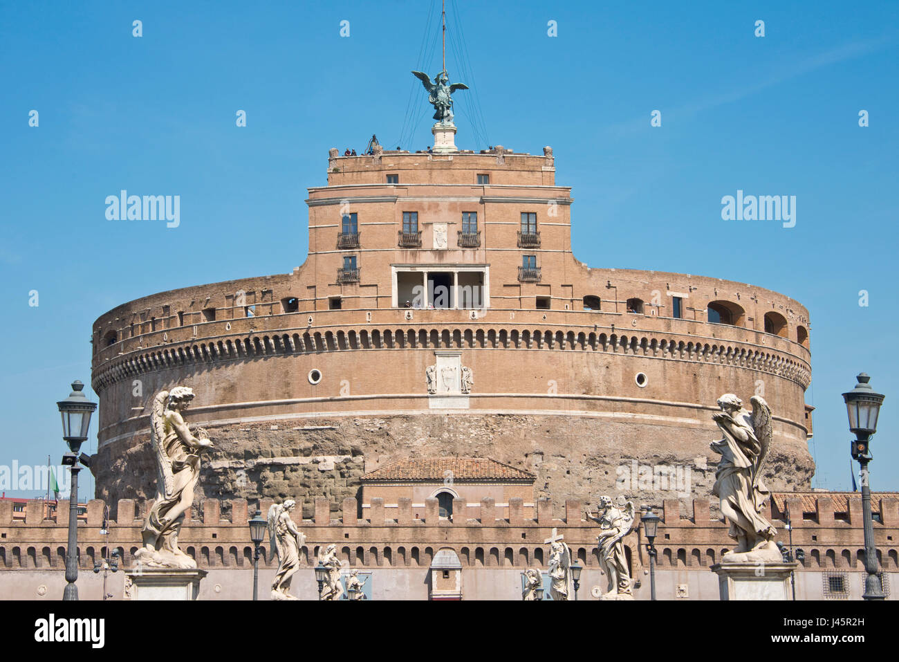 The Castel Sant'Angelo with the pedestrian St. Angelo Bridge or Ponte Sant'Angelo statues across ...