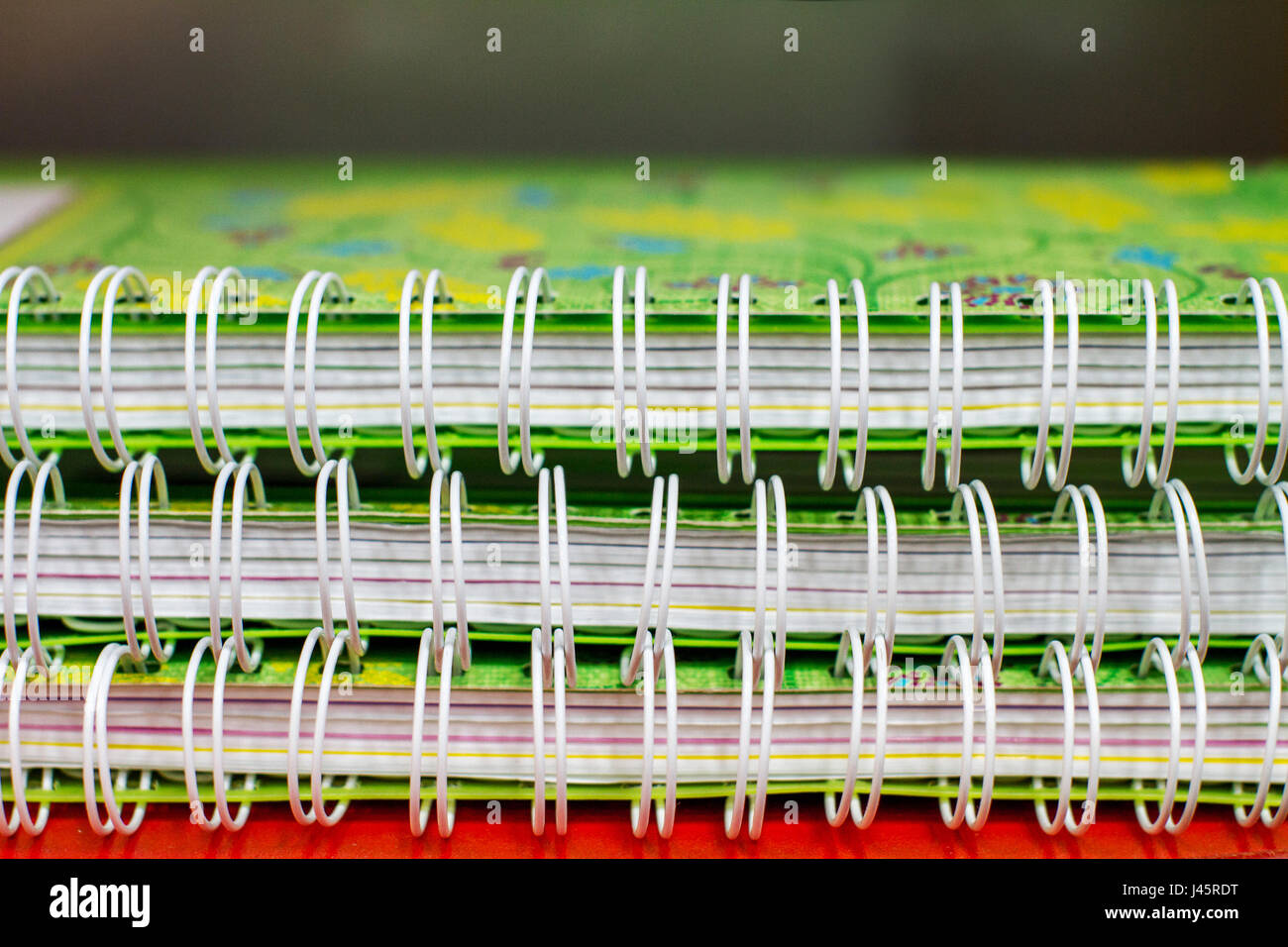 a Preview binding three green student notebooks Stock Photo - Alamy