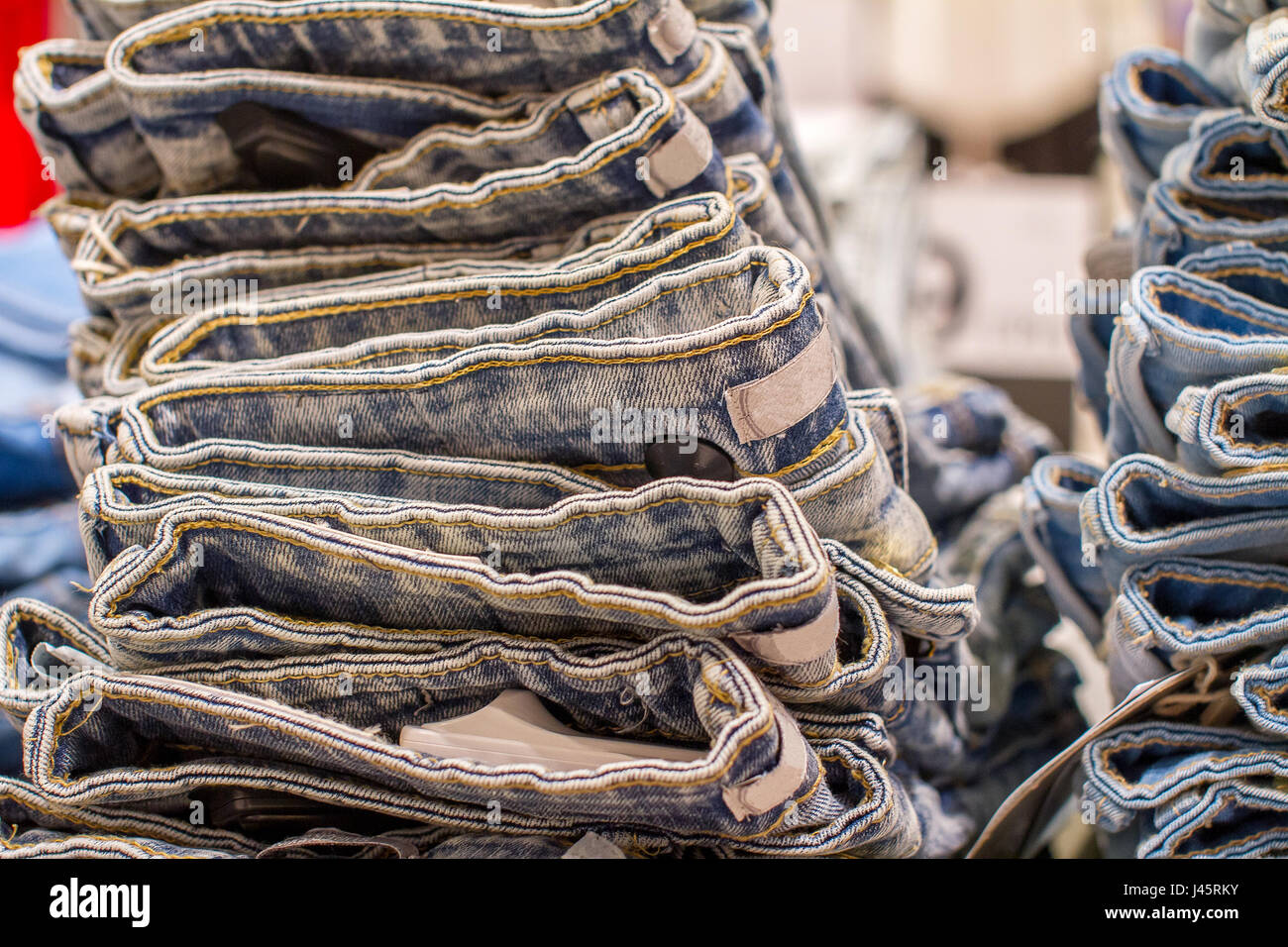 image stack of folded jeans in the store Stock Photo - Alamy