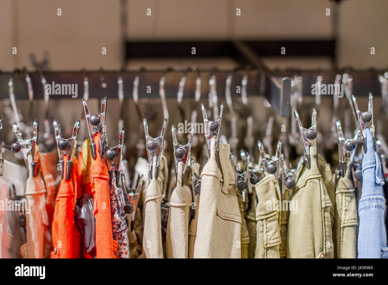 Denim jeans hanging on closet hi-res stock photography and images - Alamy