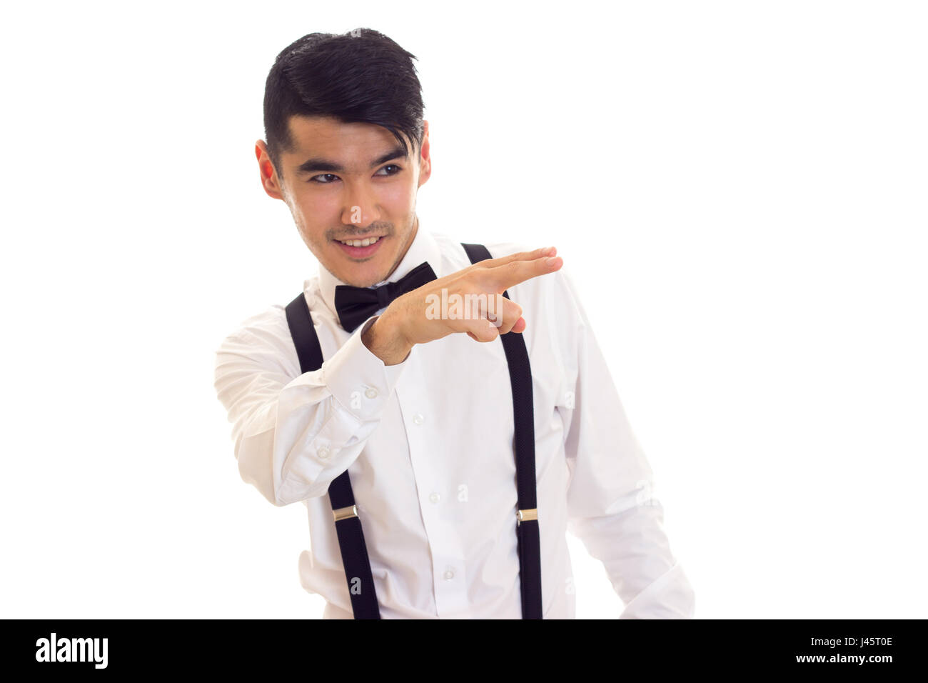 Young man with bow-tie and suspenders Stock Photo - Alamy