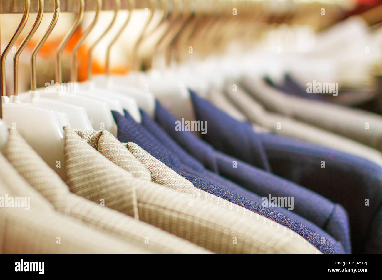 image stylish jackets hanging on the rack in the store Stock Photo - Alamy
