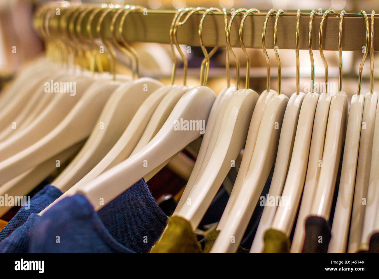 picture hangers to the goods in the storec Stock Photo - Alamy