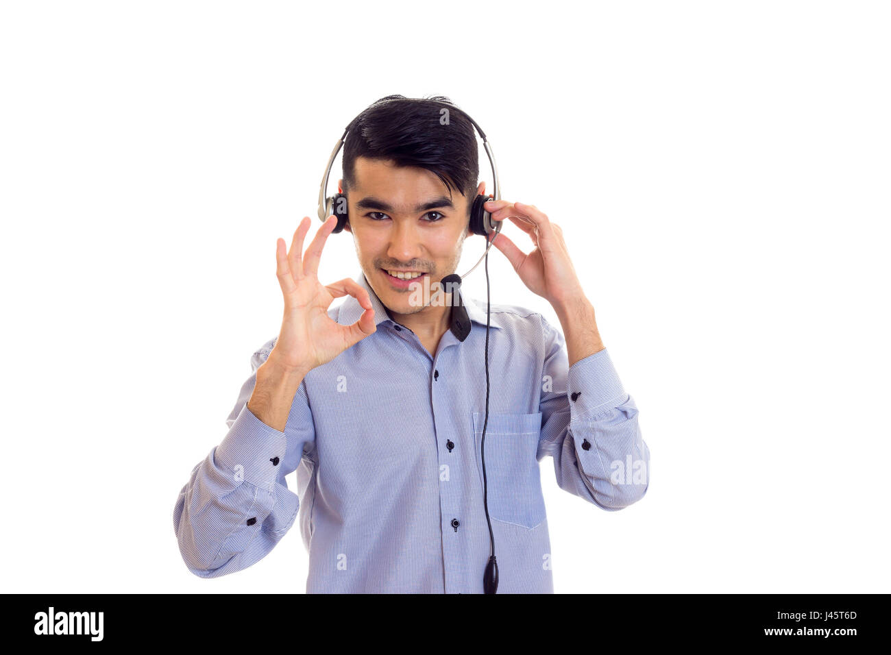 Young man using headphones Stock Photo - Alamy