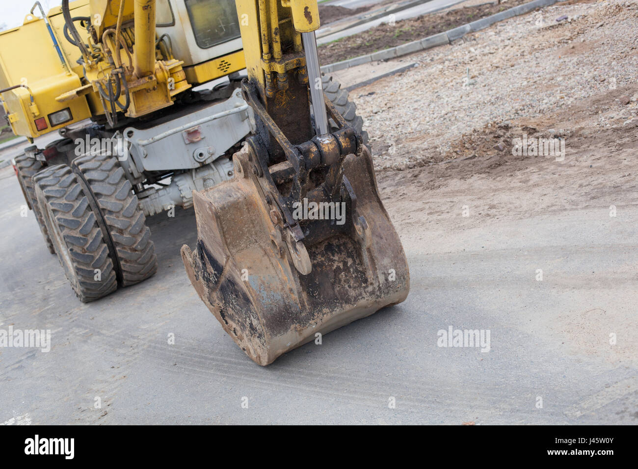 Work excavator at the construction site Stock Photo - Alamy