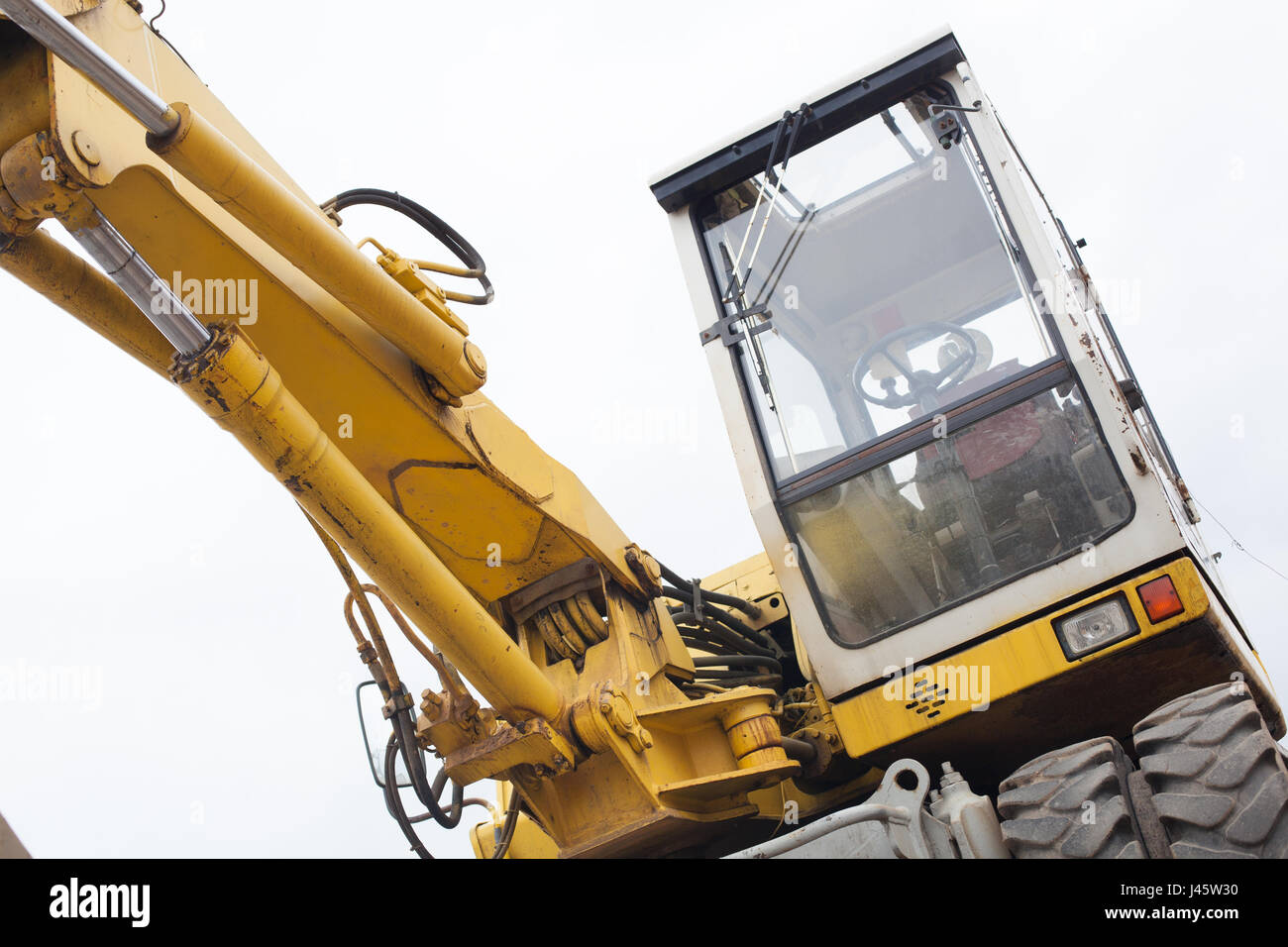 Construction excavator front view Stock Photo - Alamy