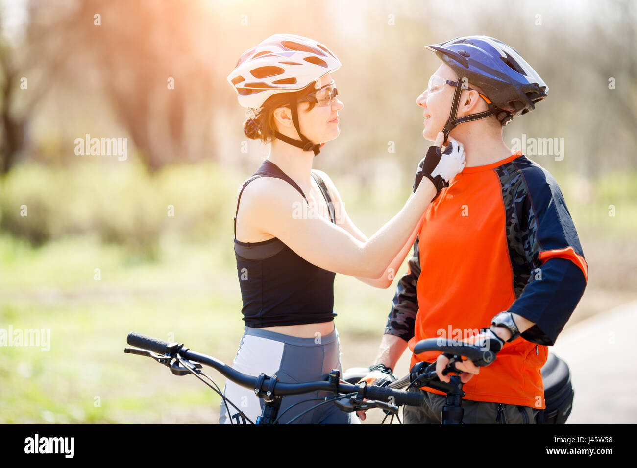 Two friends wear bike helmets Stock Photo - Alamy