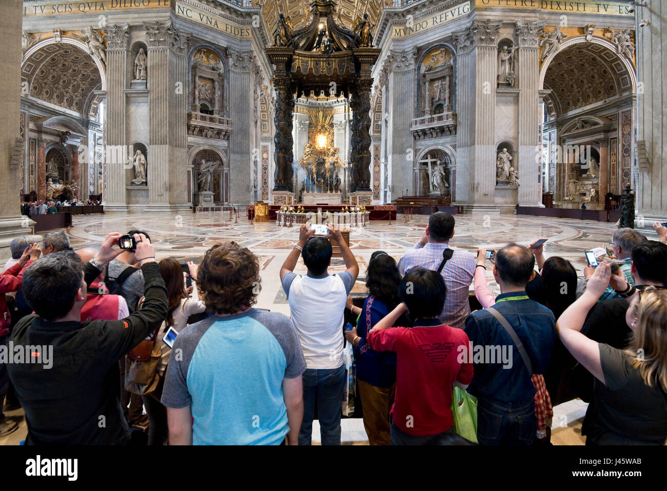 A wide angle interior view inside St Peter's Basilica of the main alter ...