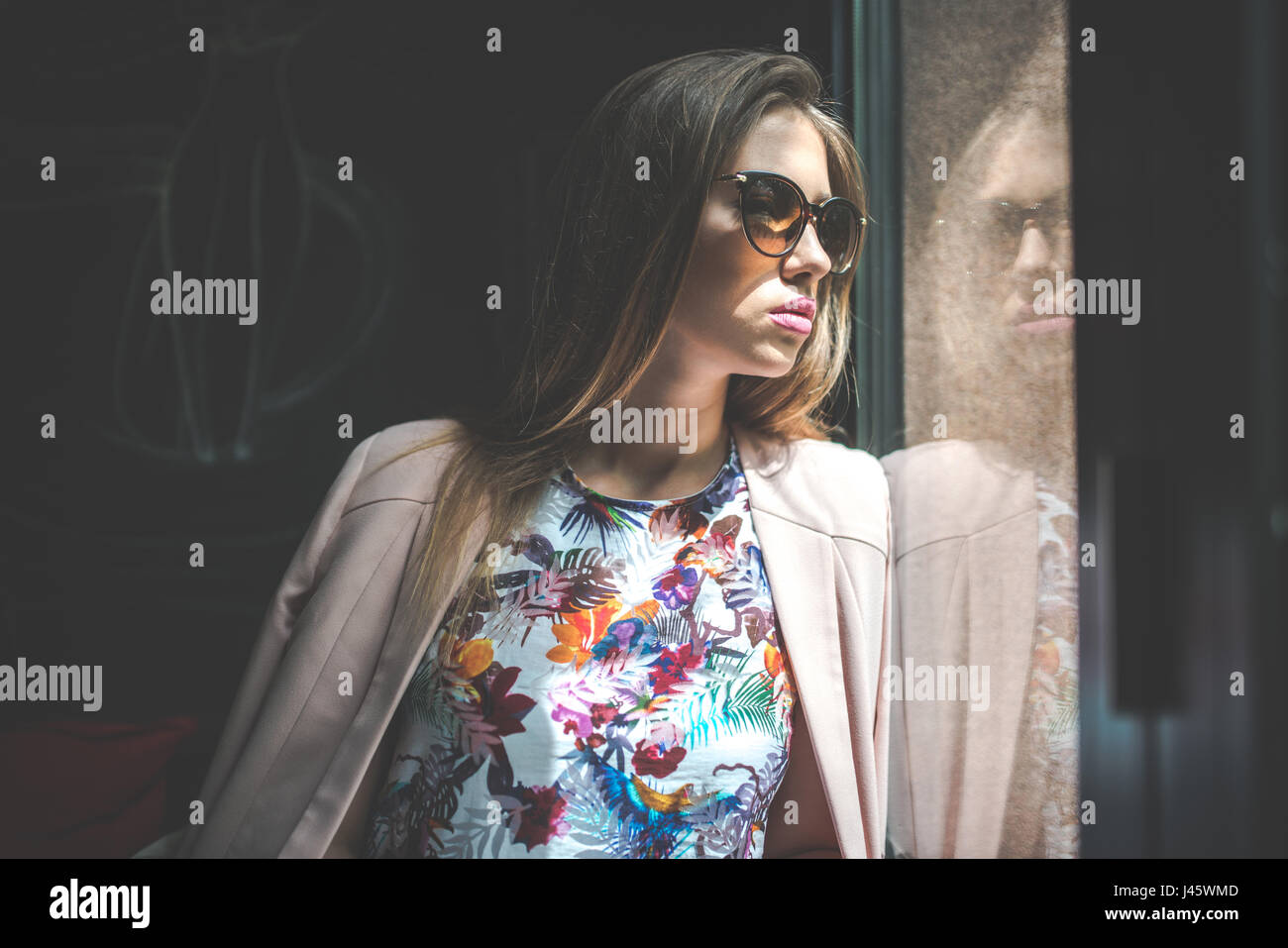 By the window Stock Photo - Alamy