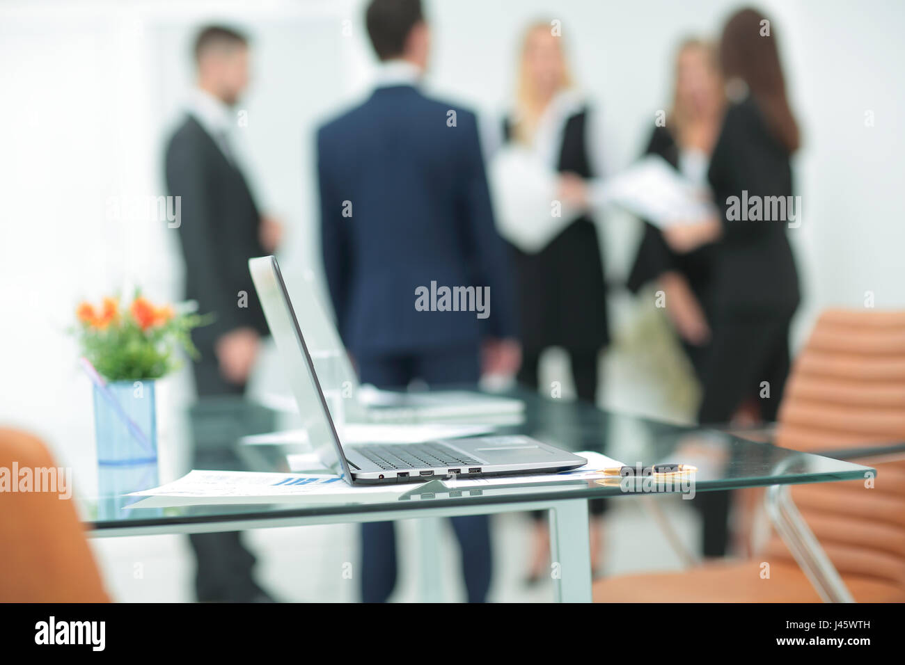 Team work process. Young business crew in big loft office. Lapto Stock ...