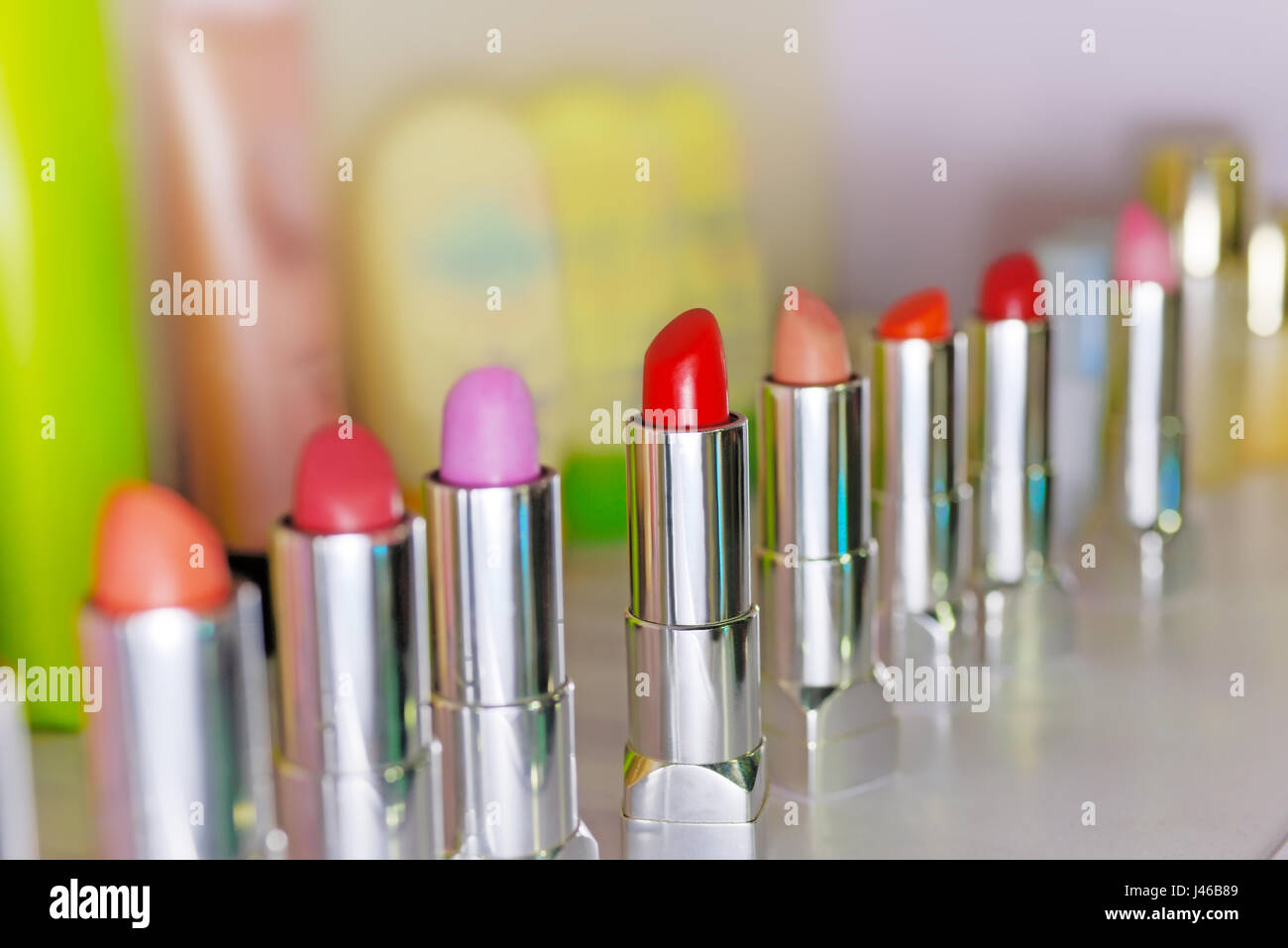 Close up of various brightly colored lipstick Stock Photo - Alamy