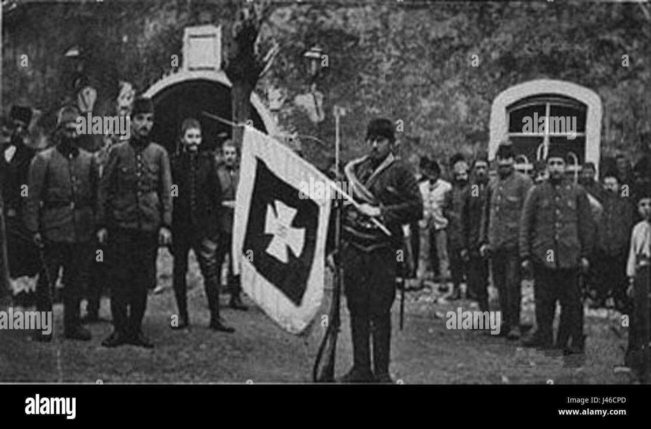 Ottoman soldiers are seen holding the captured standard of the ...
