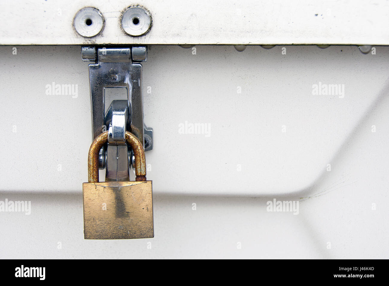 close up of brass padlock on storage box with water droplets Stock ...