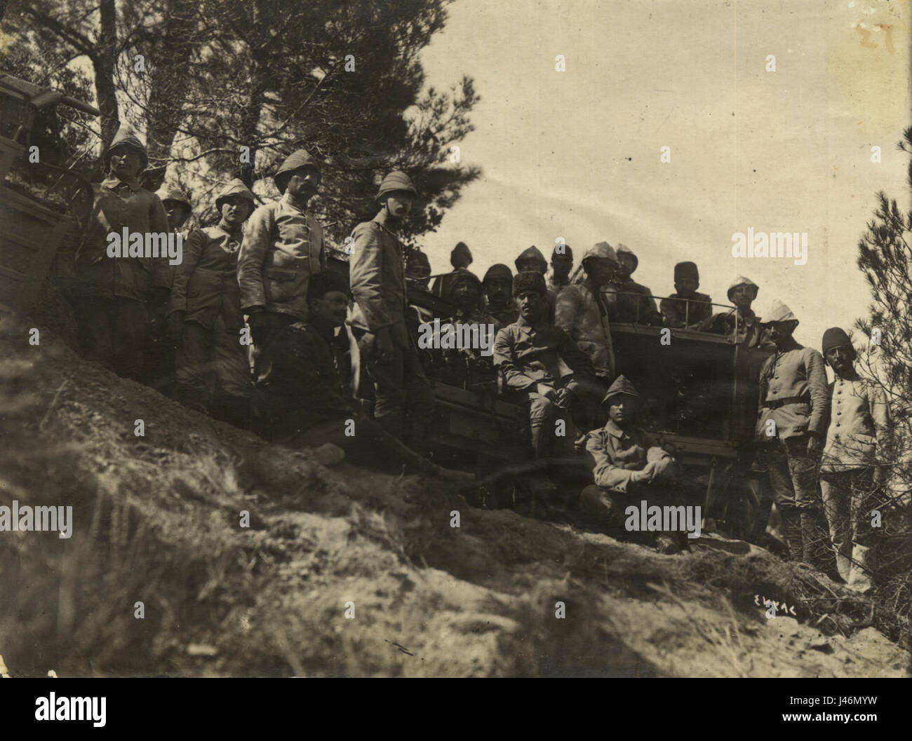 This historical image shows Ottoman soldiers around a gun mount ...