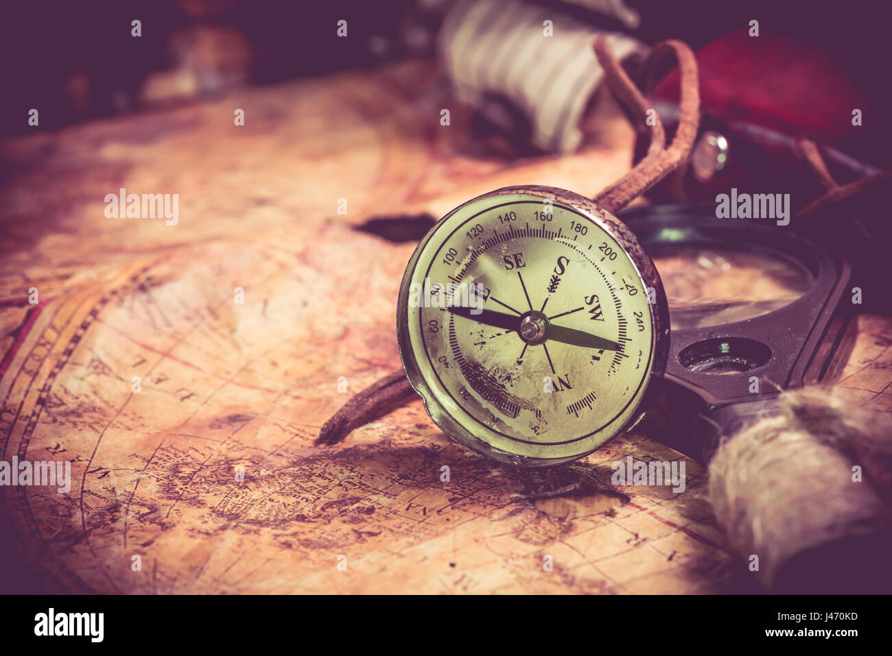 Columbus day and world map with compass Stock Photo - Alamy