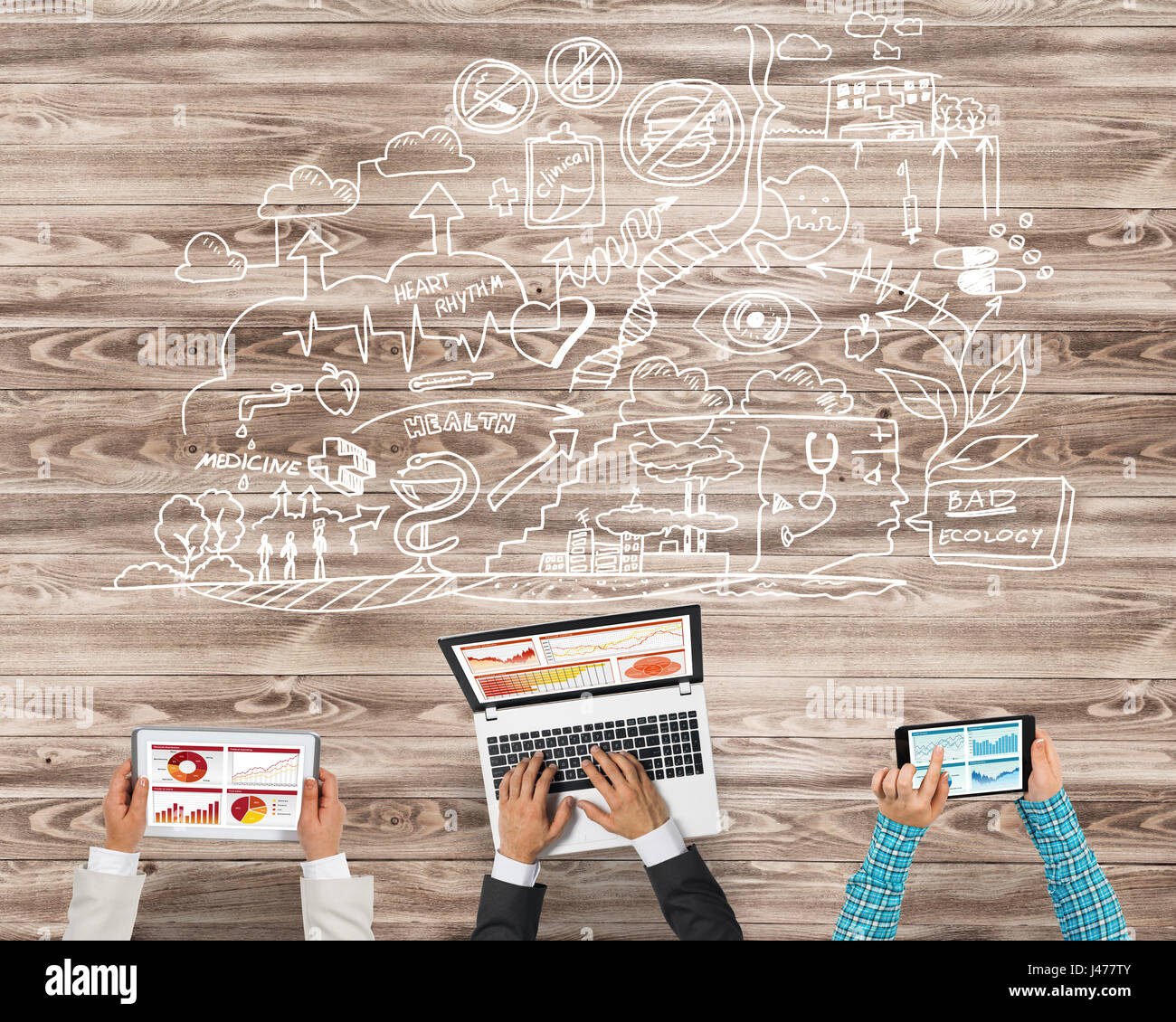 Group of three people with devices in hands working together as symbol ...