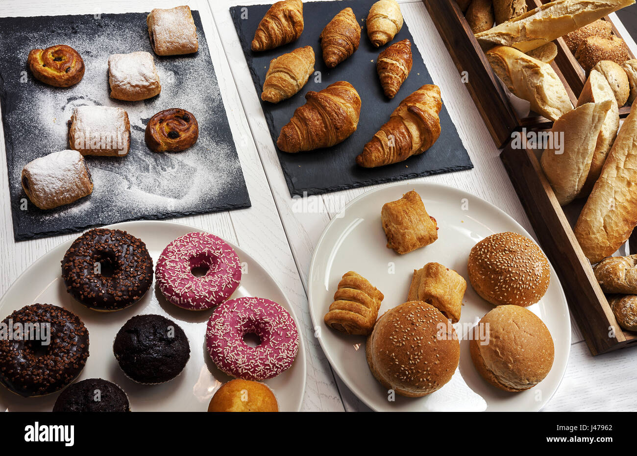 A lot of various pastry and colorful cakes on table Stock Photo - Alamy