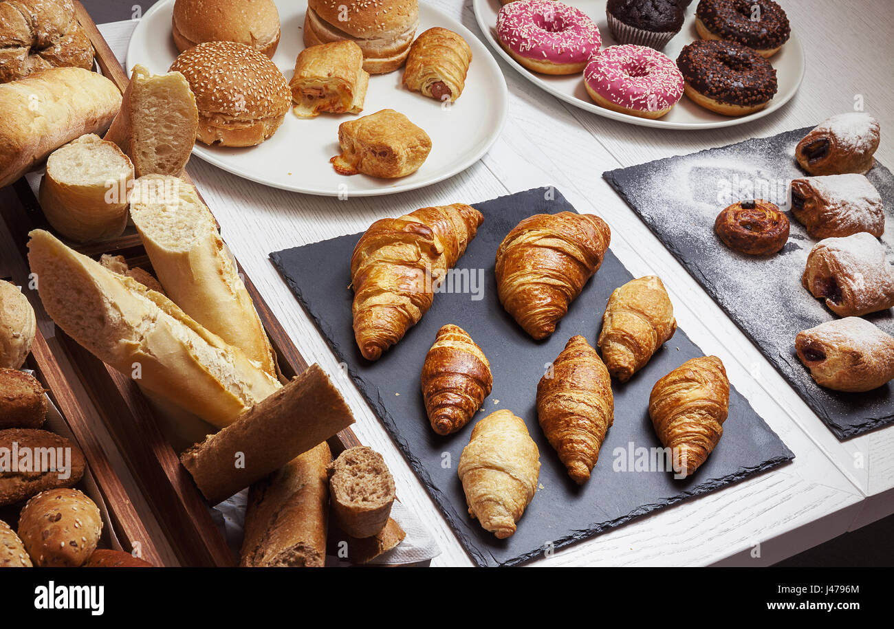 A lot of various pastry and colorful cakes on table Stock Photo - Alamy