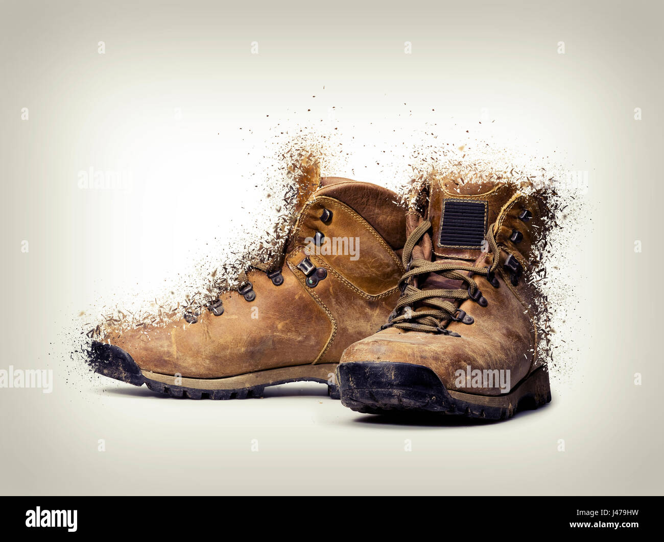 pair of hiking shoes shattered on gradient background Stock Photo - Alamy
