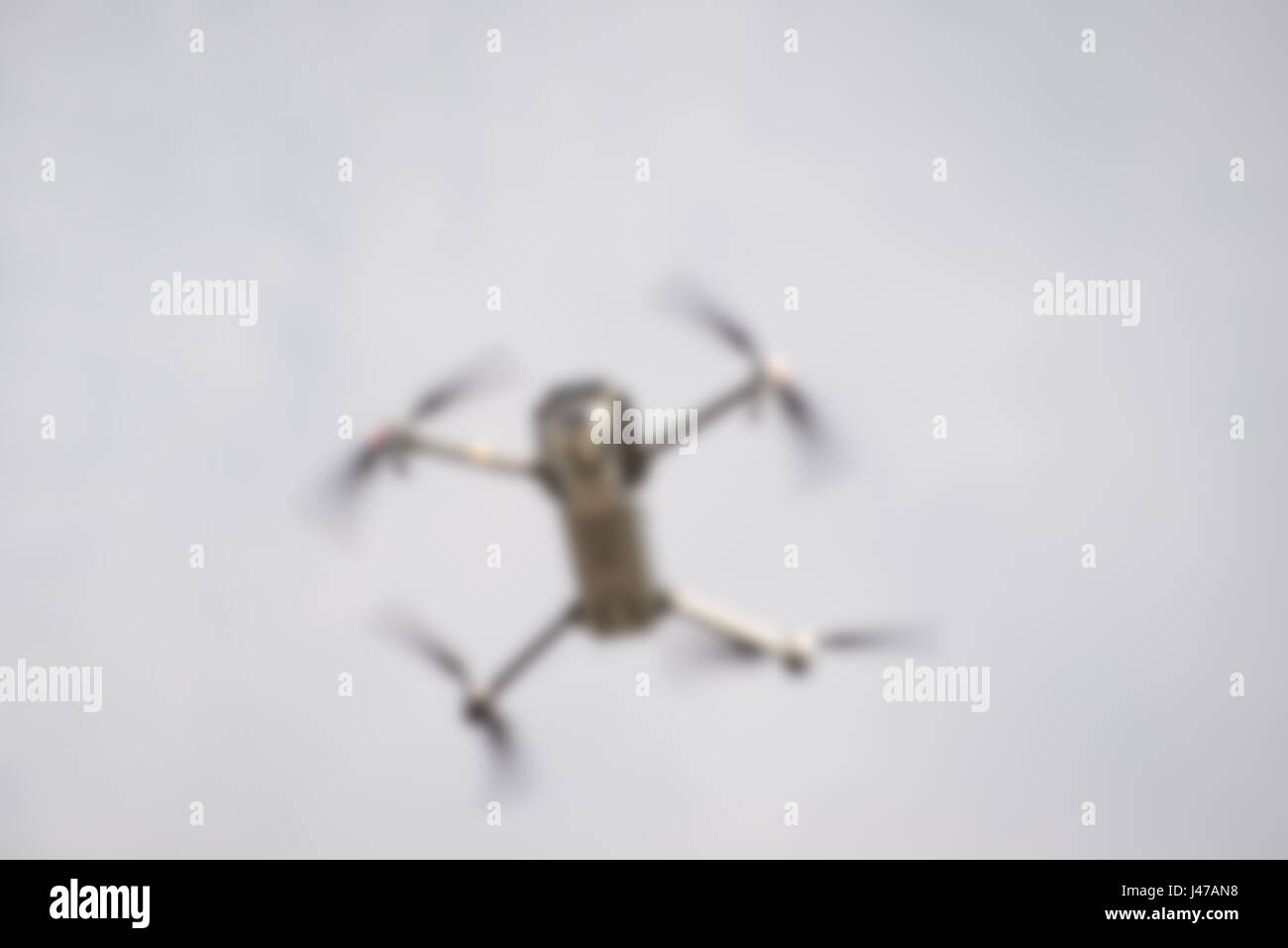 Abstract blur drone quadrocopter in flight for background, technology ...