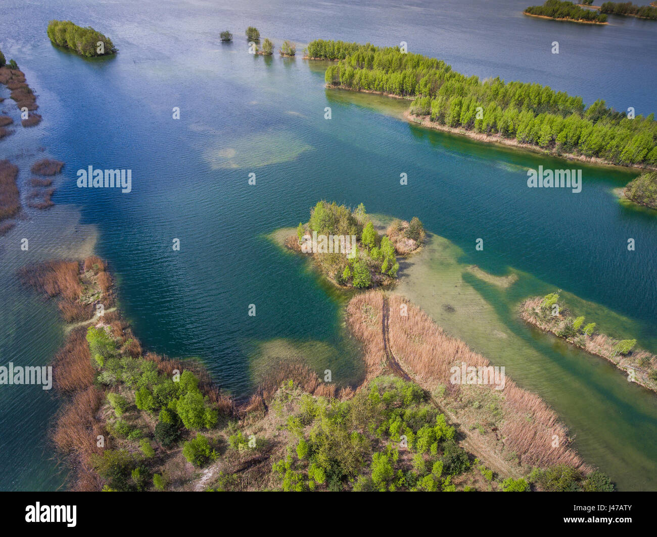 Lake and forest during spring time. View from above. Pogoria IV in ...