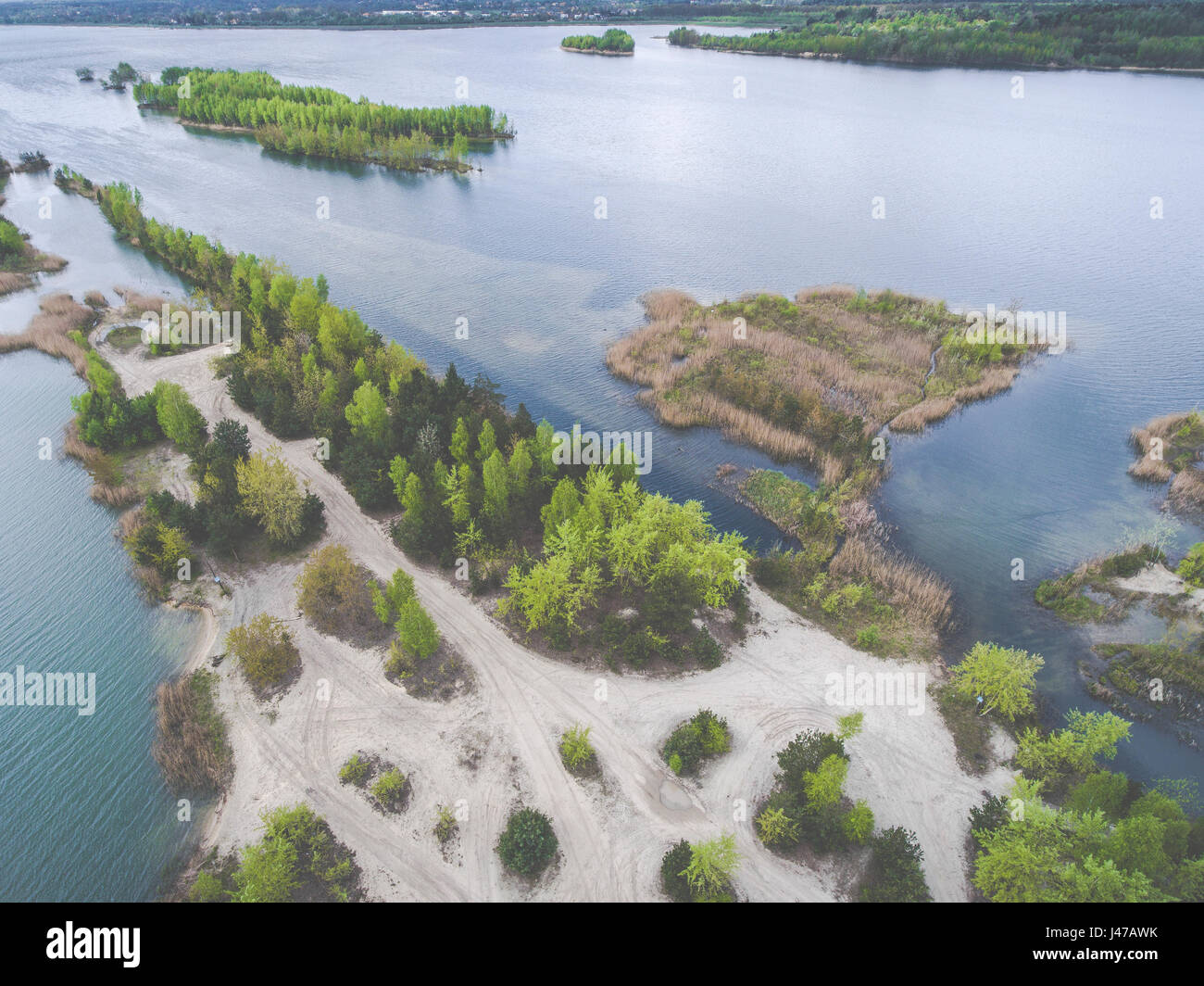 Lake and forest during spring time. View from above. Pogoria IV in ...
