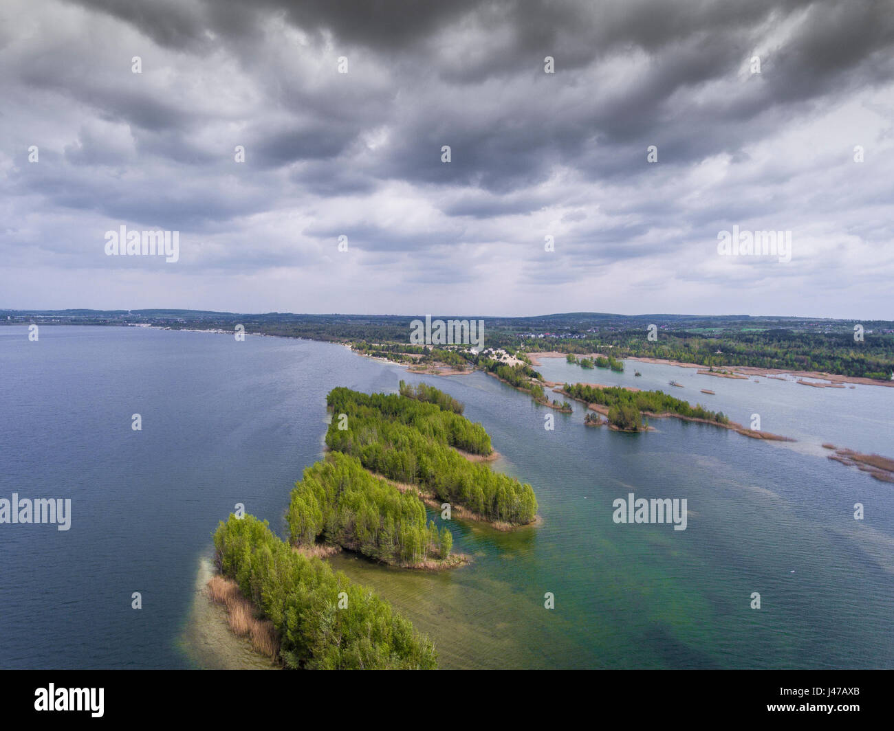Lake and forest during spring time. View from above. Pogoria IV in ...