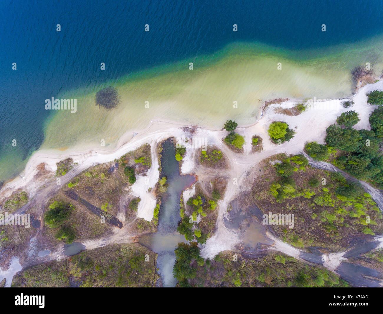 Lake and forest during spring time. View from above. Pogoria IV in ...