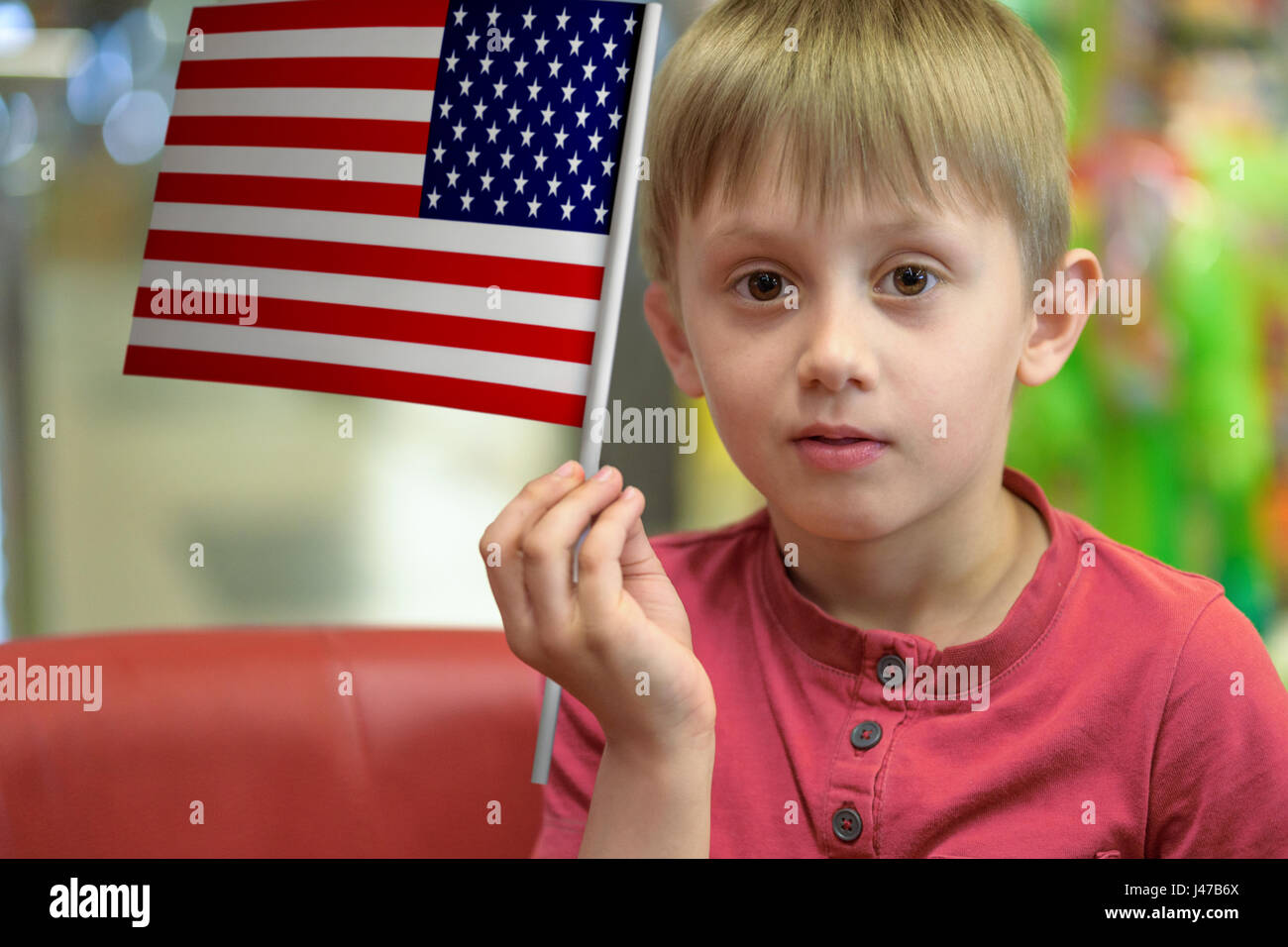 Toddler holding american flag hi-res stock photography and images - Alamy